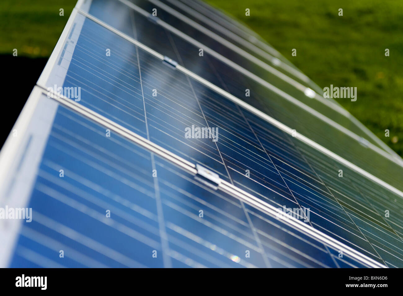 Detail of photo-voltaic solar panels in an array in the UK Stock Photo ...