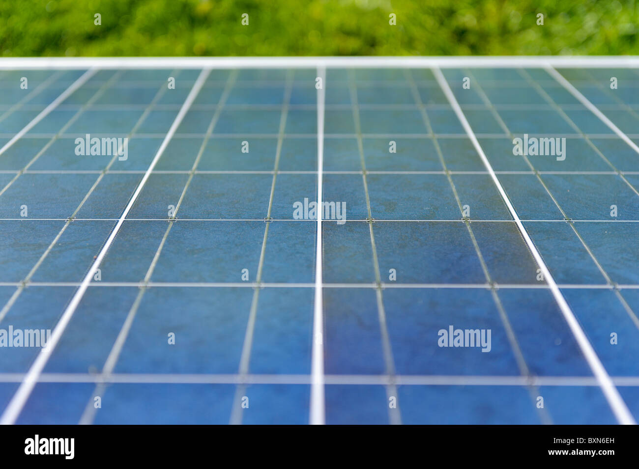 Detail of photo-voltaic solar panels in an array in the UK Stock Photo ...