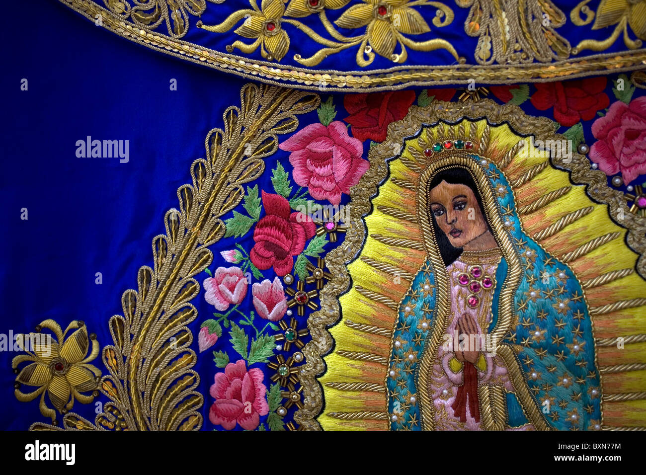 Detail of an embroidered banner of the Our Lady of Guadalupe is ...
