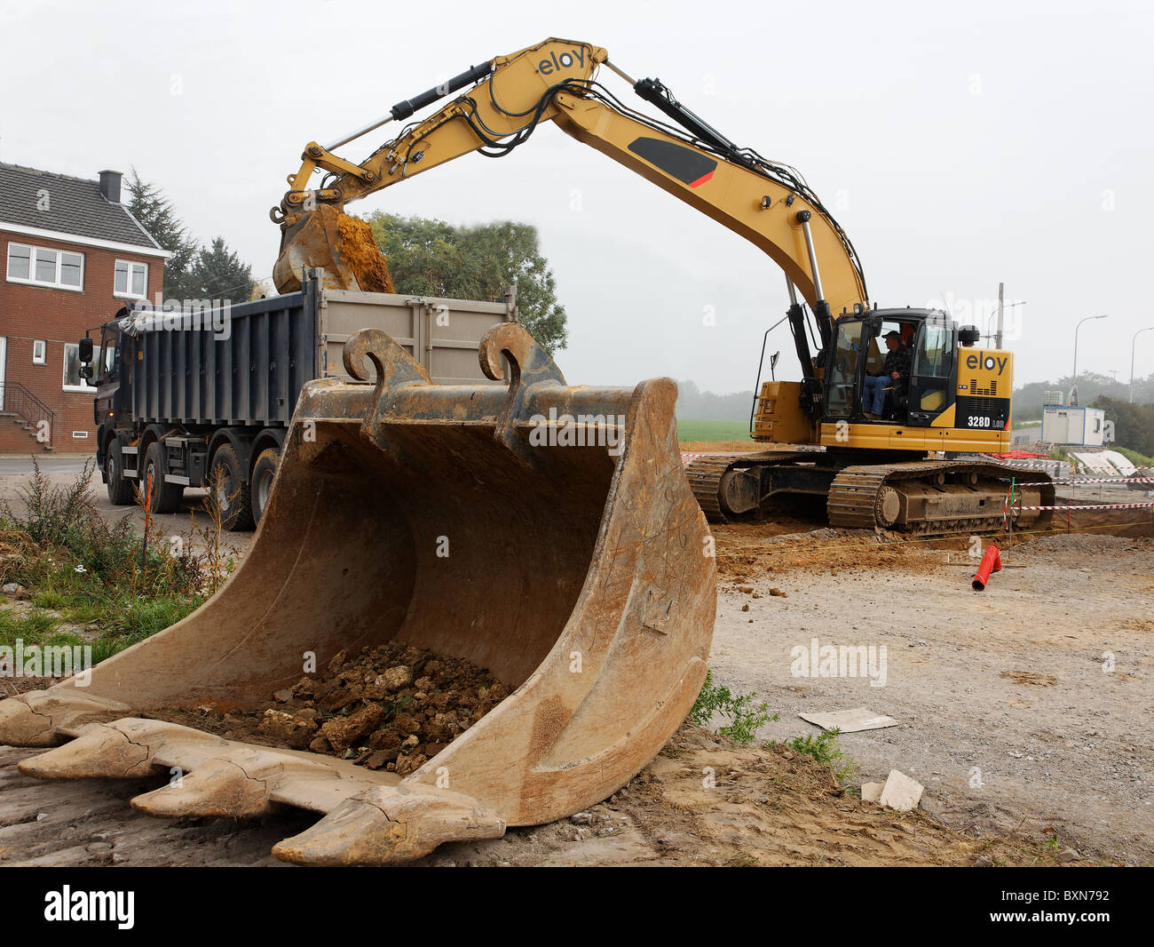 Excavator tracked machine on construction site during earth moving ...