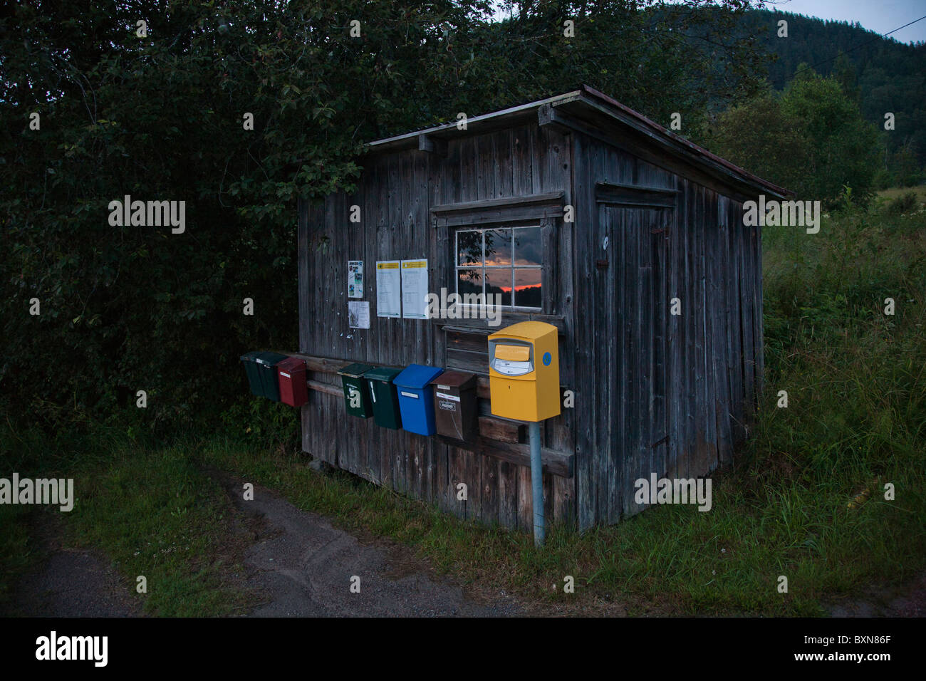 Shed with letter boxes and post box on a summer night in Varmland ...