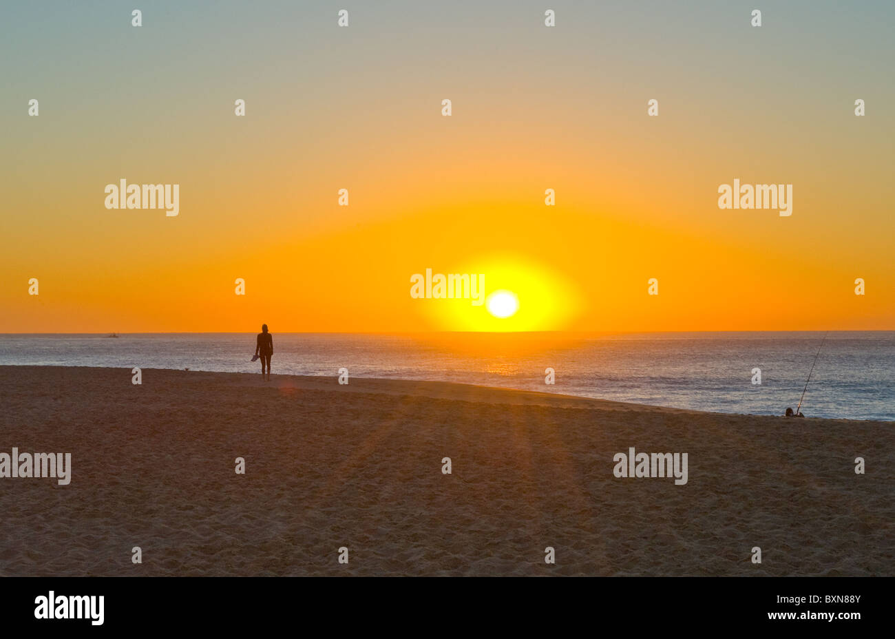 sun sunrise on pacific ocean shore woman on beach orange rising sun ...