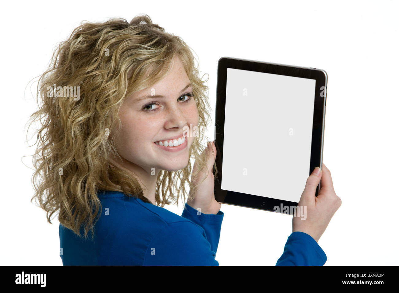 Attractive teenage girl holding an Ipad isolated on white background ...