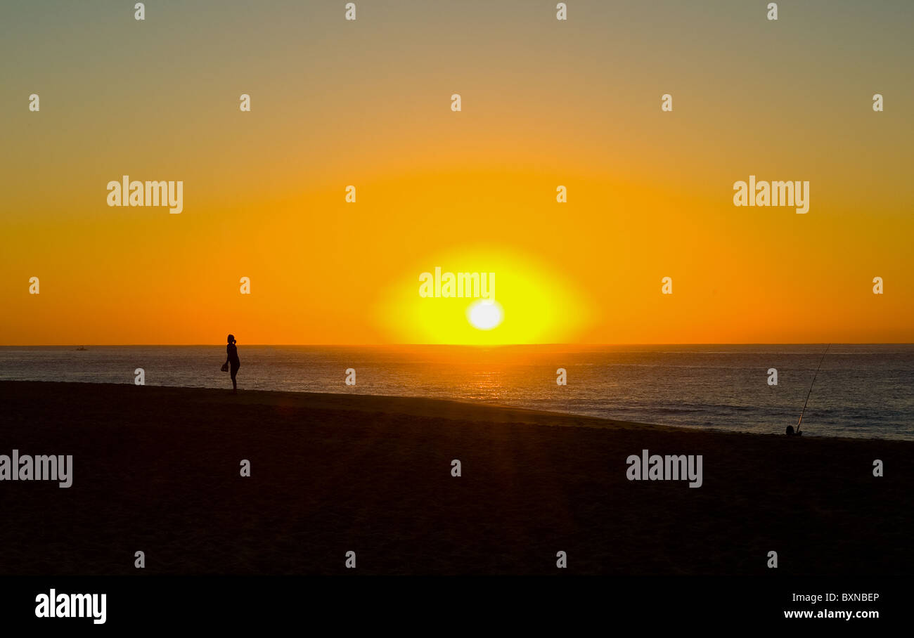 sun sunrise on pacific ocean shore woman on beach orange rising sun ...