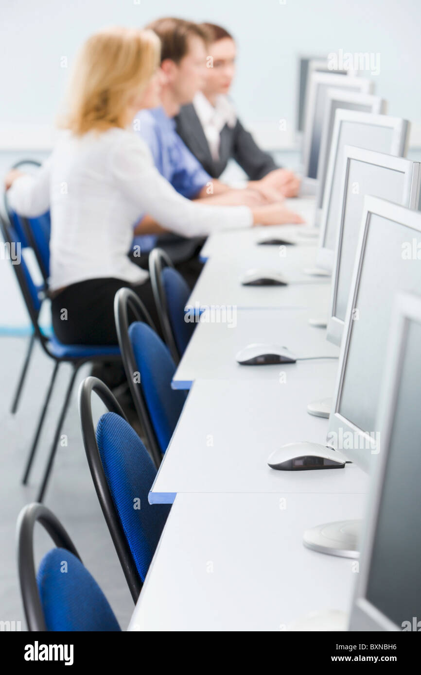 Students are sitting at tables in the computer room Stock Photo - Alamy