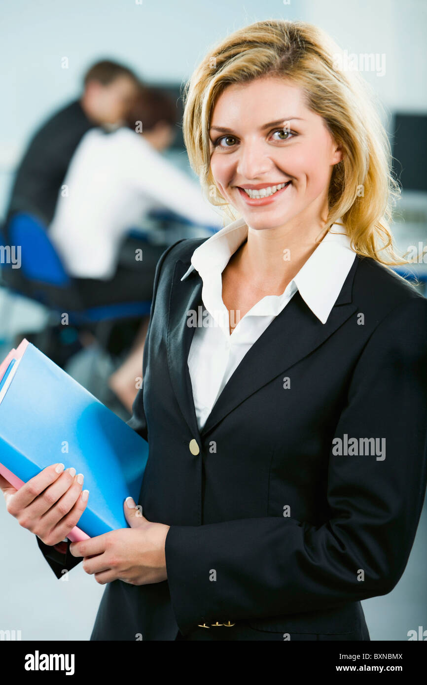 Portrait Of Smart Smiling Business Woman Holding The Folders Stock