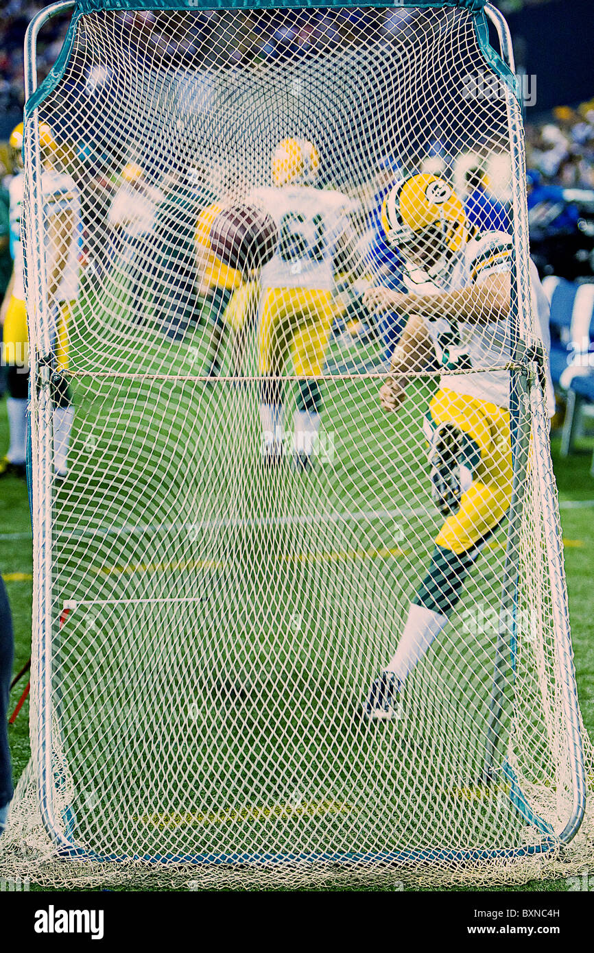 Green Bay Packers Kicker Mason Crosby practicing on the sidelines ...