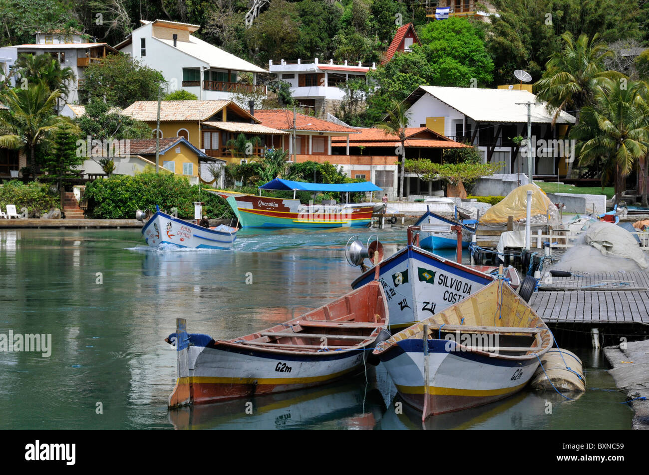 Boats and houses on canal, Fishing village, Barra da Lagoa ...