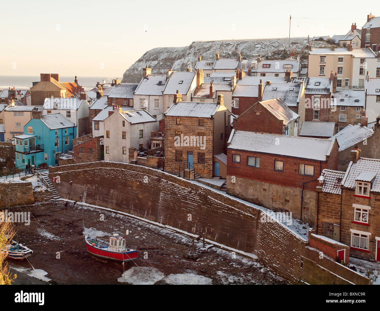 The historic village of Staithes North Yorkshire with a covering of ...