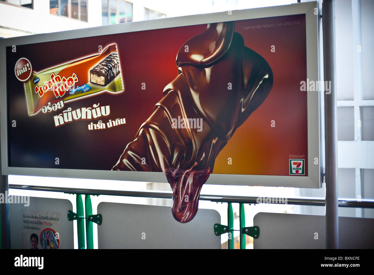 Dripping chocolate on 7 11 advertisement in skytrain station Stock ...