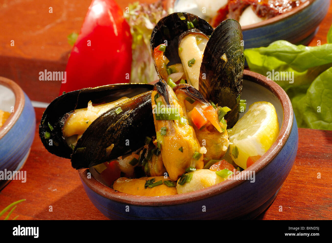 Mexican style spicy mussels Stock Photo - Alamy