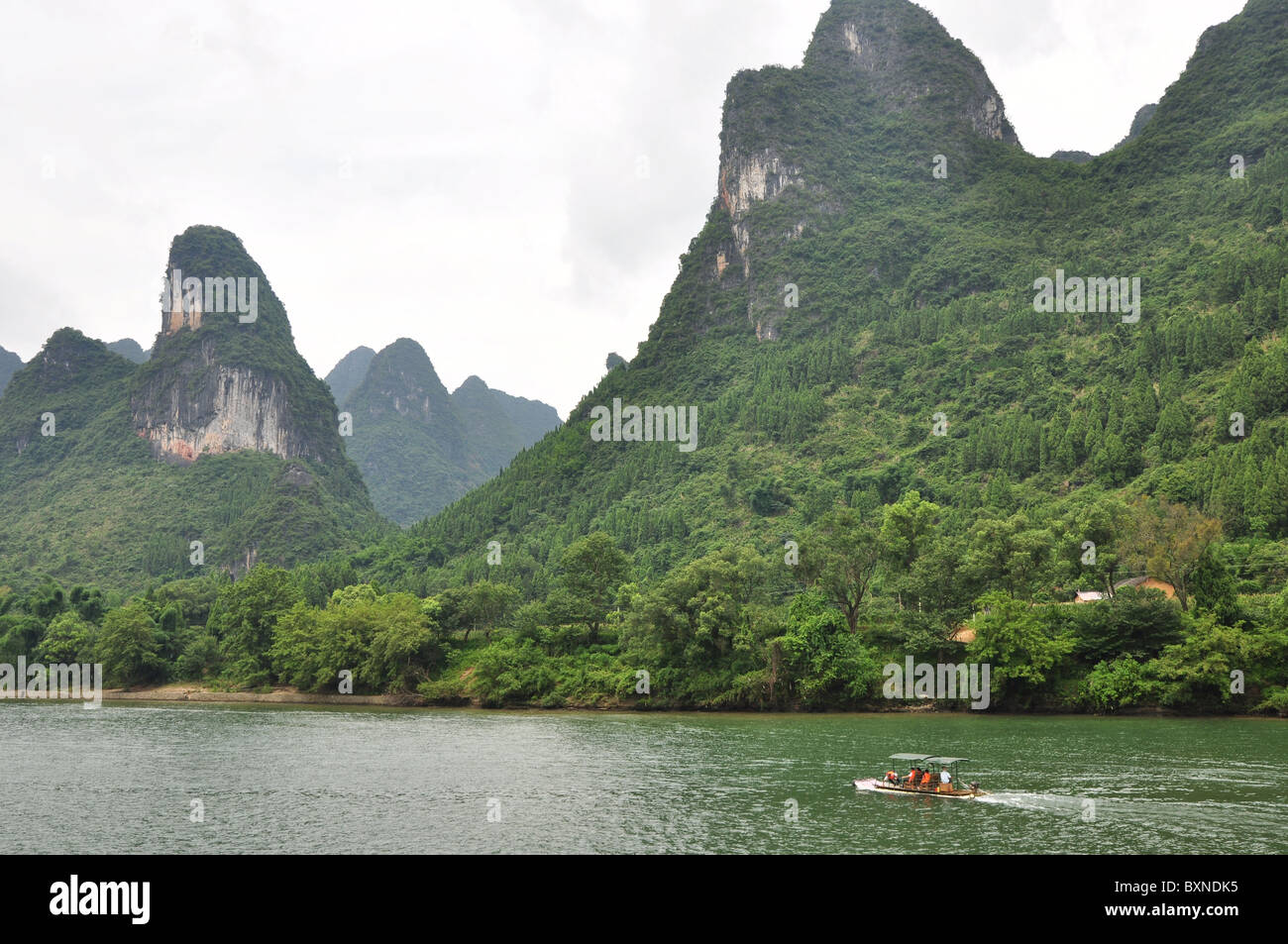 River boats on the Li River with beautiful karst hills in the ...