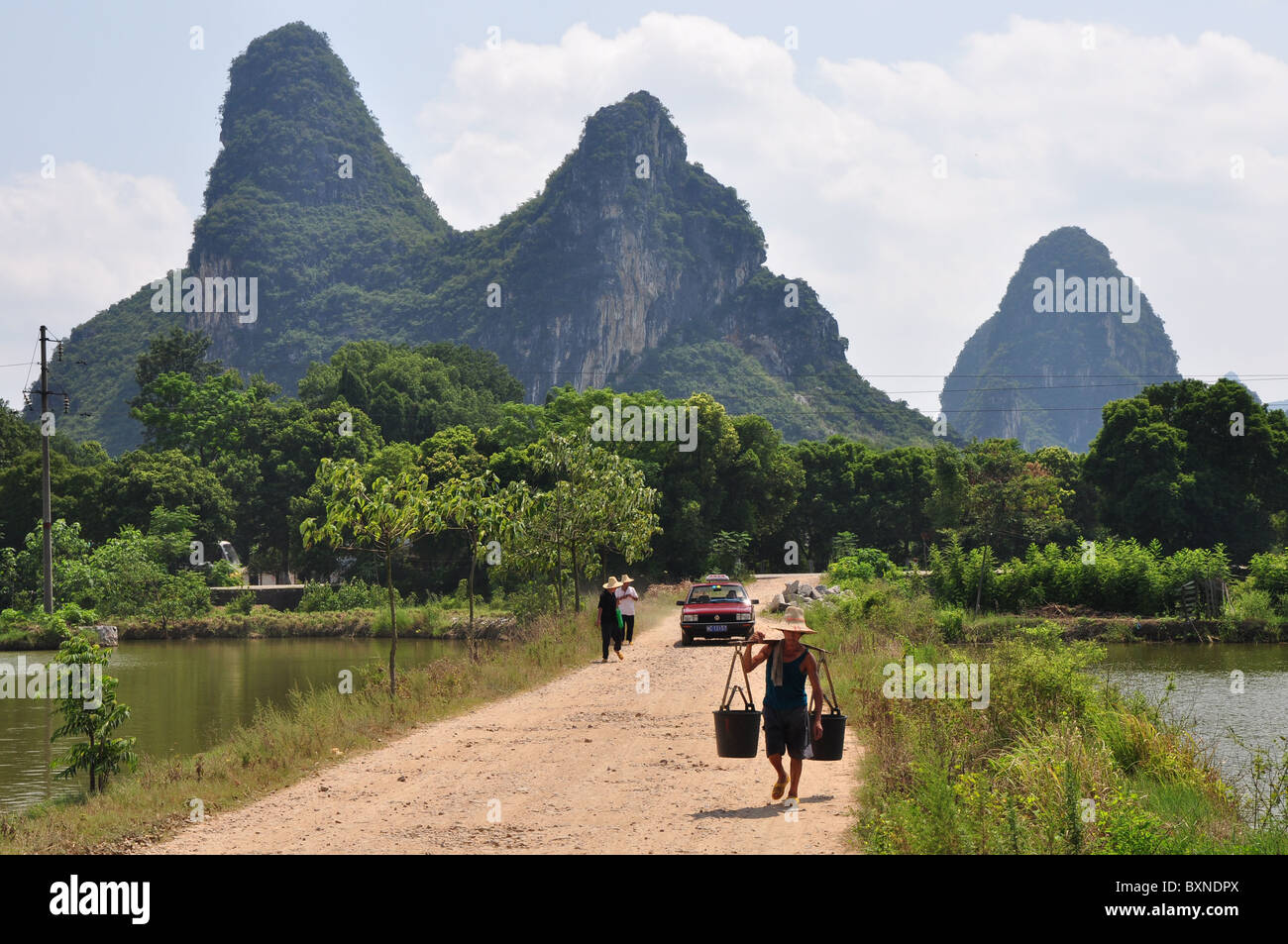 A Chinese farmer on his way home, Guilin area, Southern China Stock ...