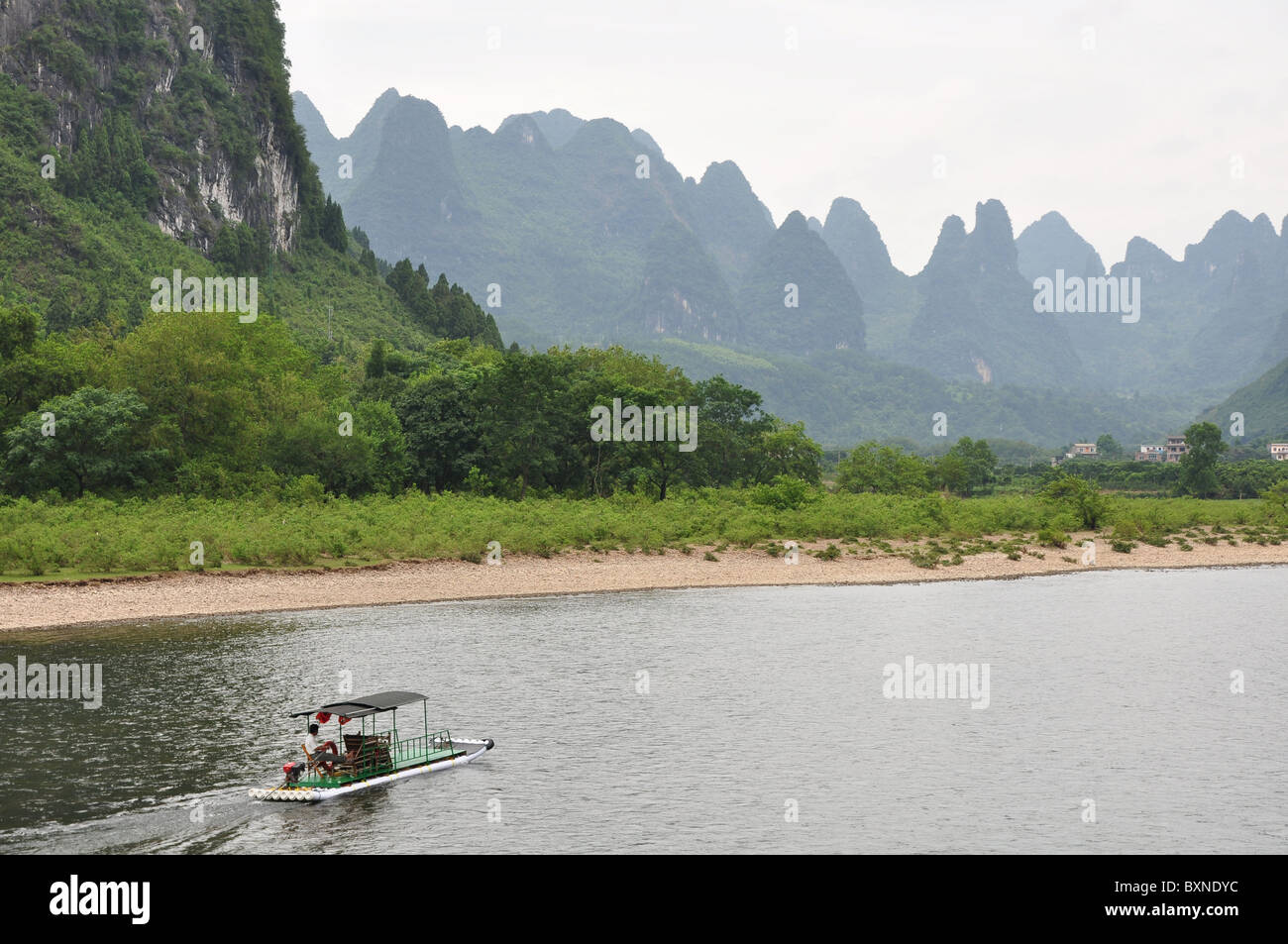 River boats on the Li River with beautiful karst hills in the ...