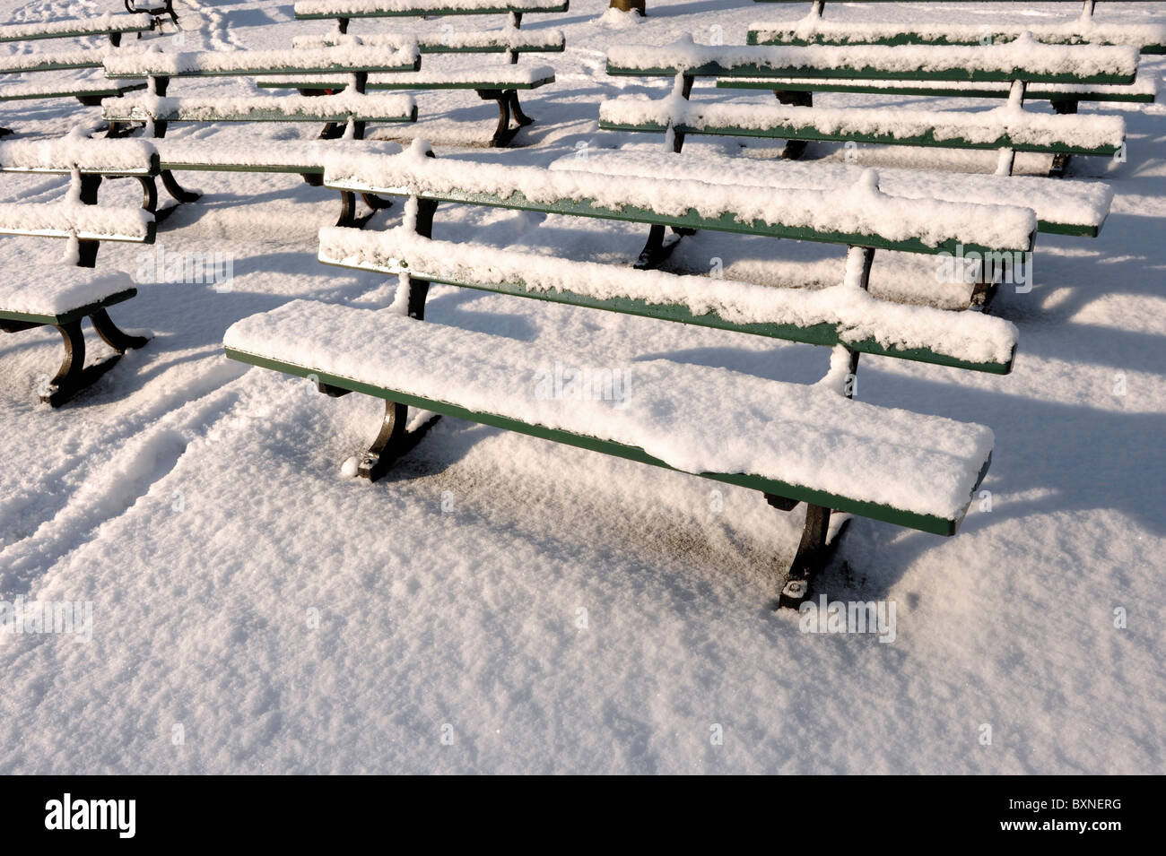 Snow covered benches Stock Photo - Alamy