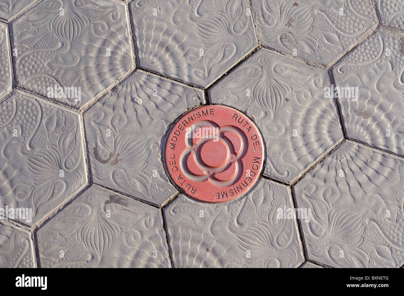 Barcelona Modernism Route mark on the city pavement Stock Photo - Alamy