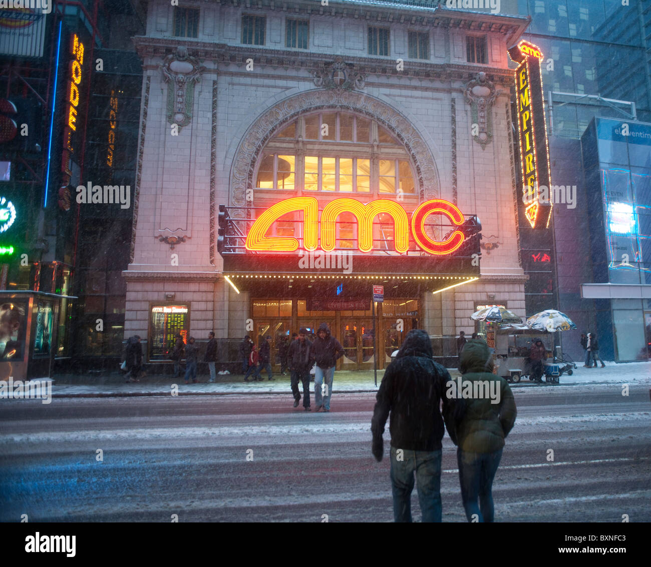 New Yorkers and visitors maneuver through the snow in Times Square in ...