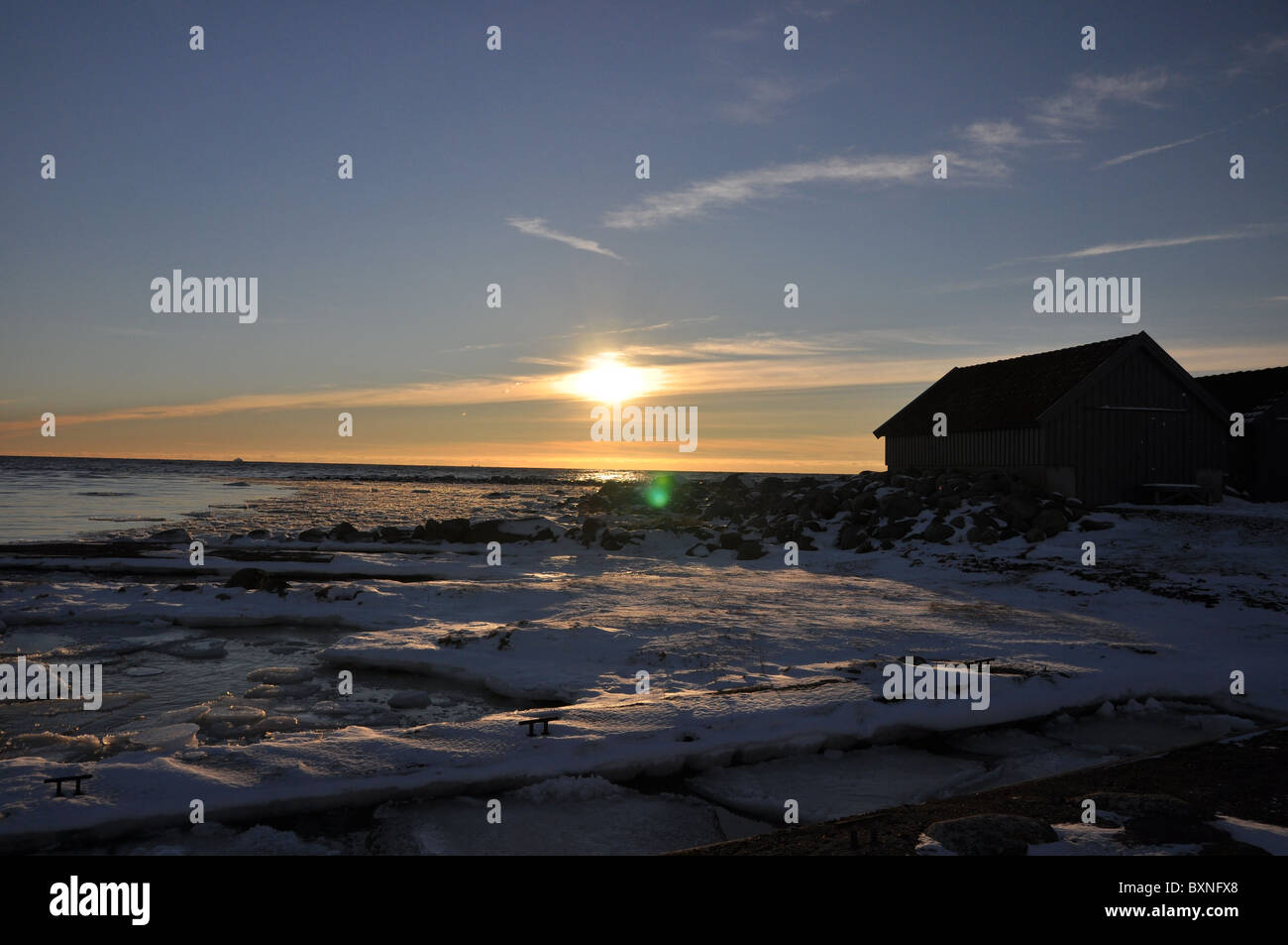 Where river meets the sea, winter, low sun, snow, boat houses, light ...