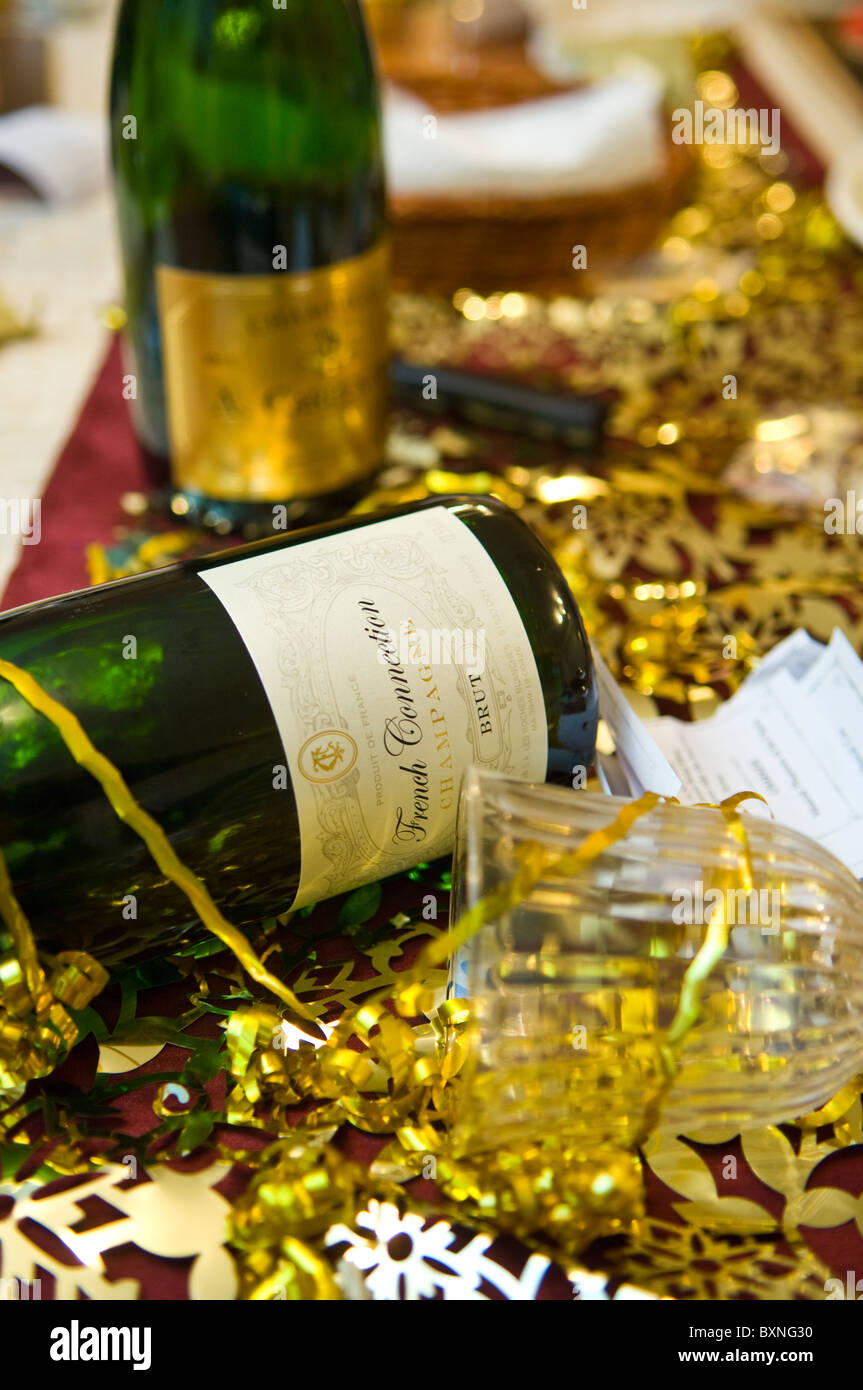 Empty Champagne bottles and glasses after a Christmas party Stock Photo ...
