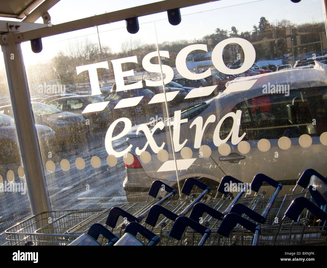 A Tesco Extra supermarket store sign etched on the plastic shopping ...