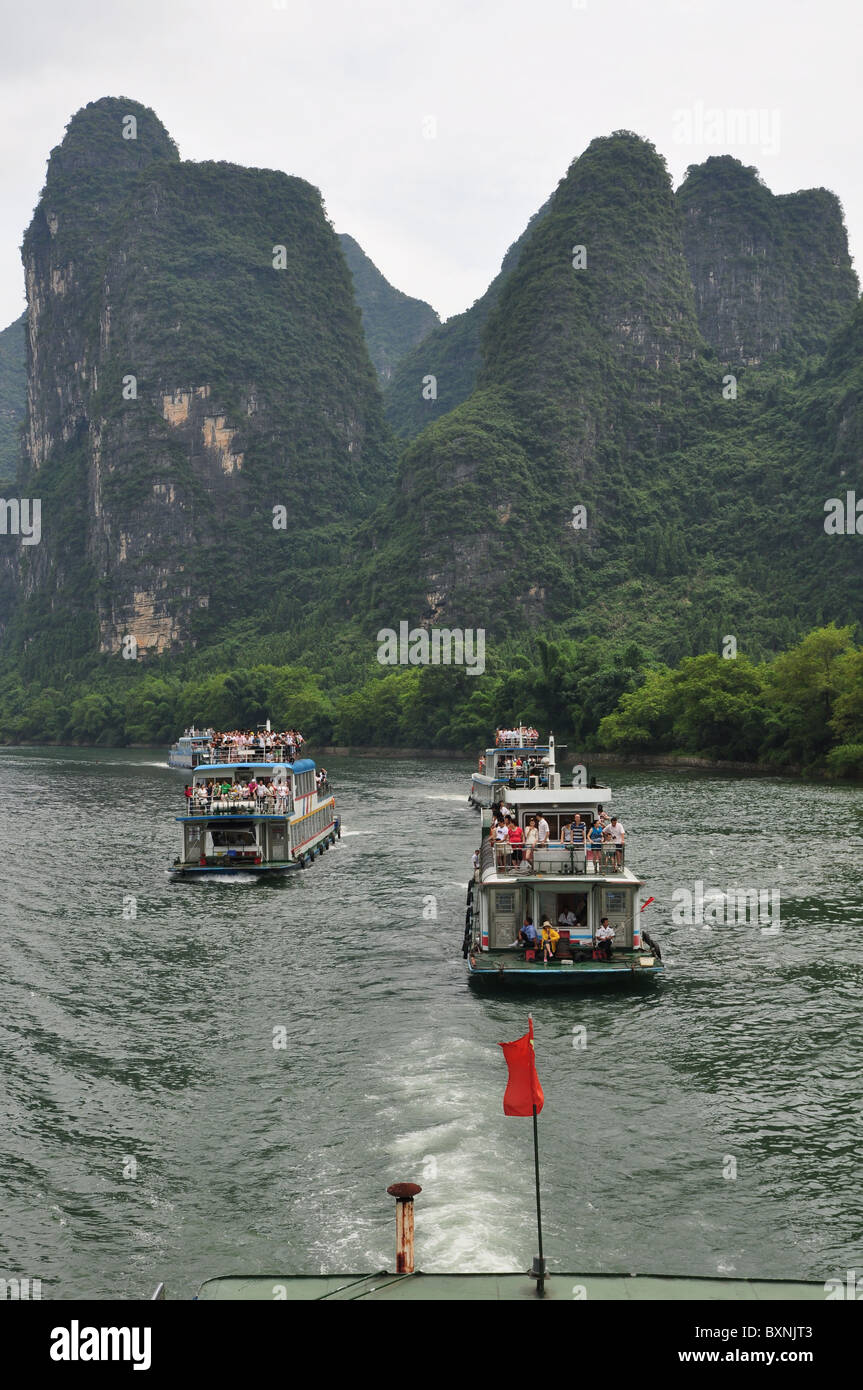 River boats on the Li River with beautiful karst hills in the ...