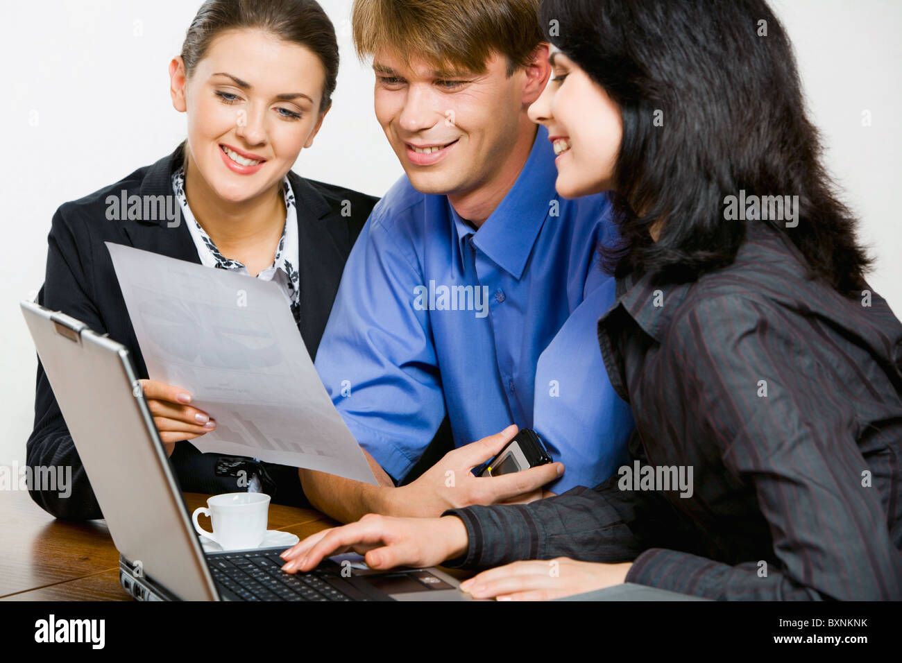 Confident professional demonstrates new strategy to her co-workers ...