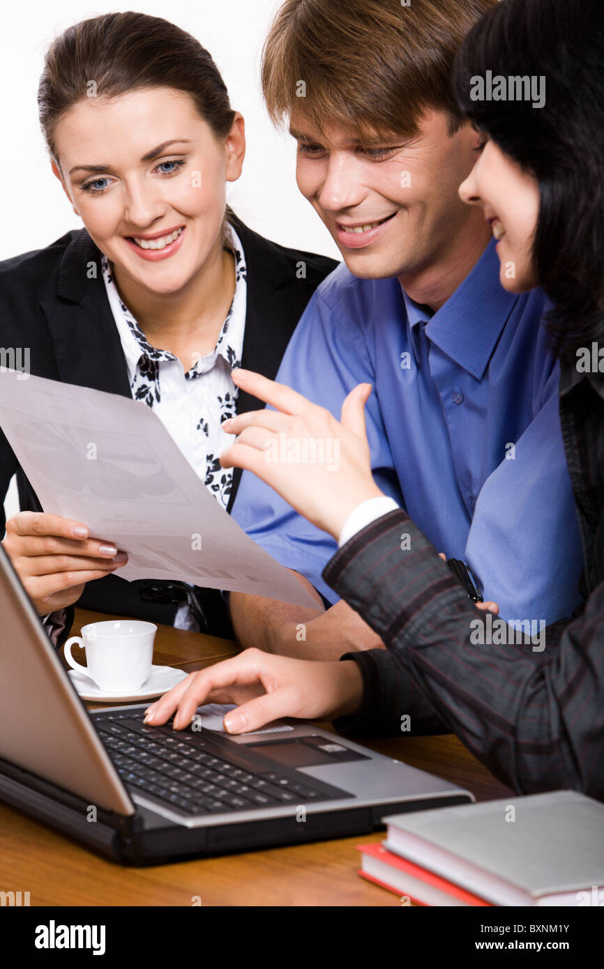 Two business demonstrating women a project to their boss Stock Photo ...