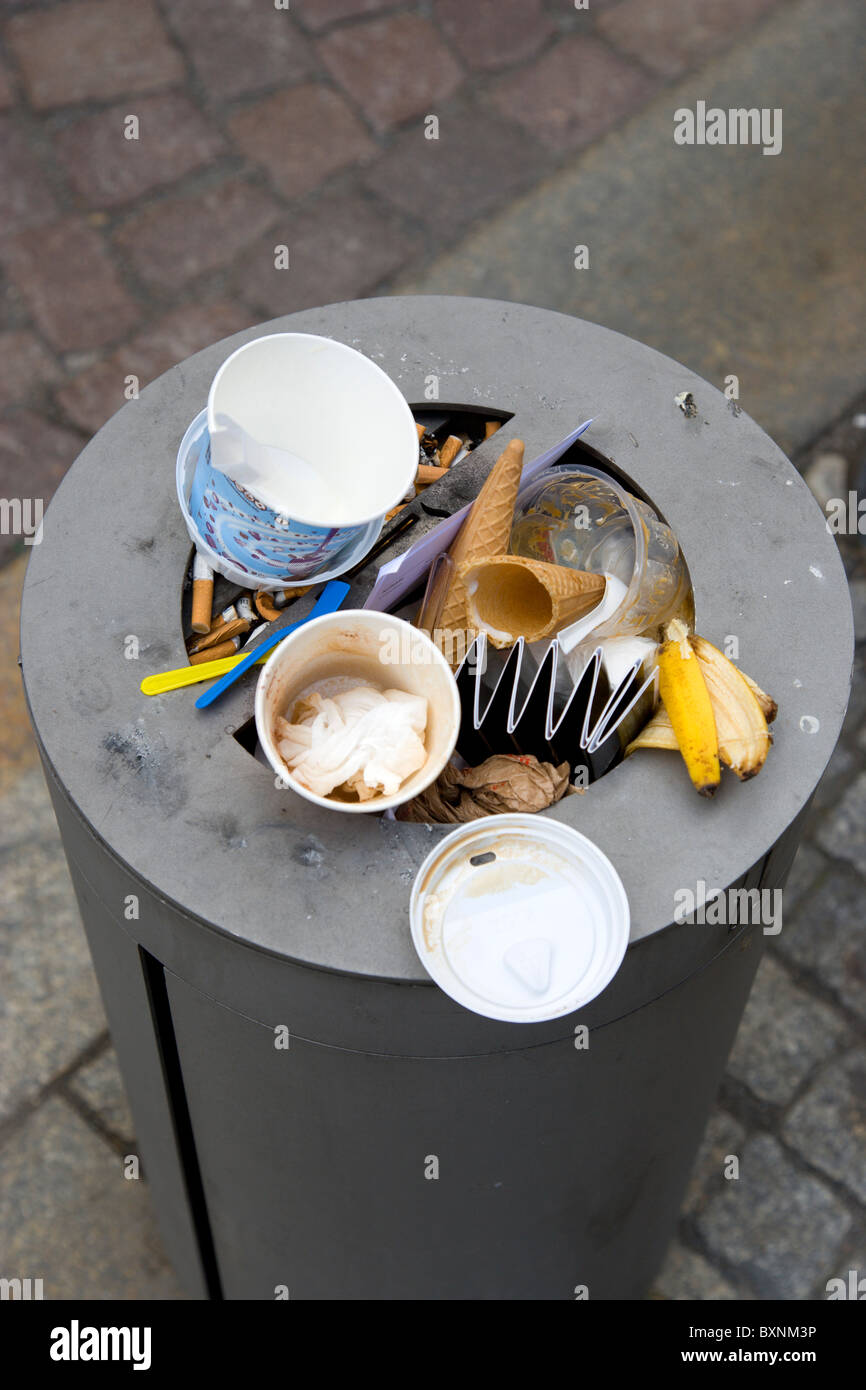 GERMANY, Saxony, Dresden, Street litter bin on sidewalk pavement full ...