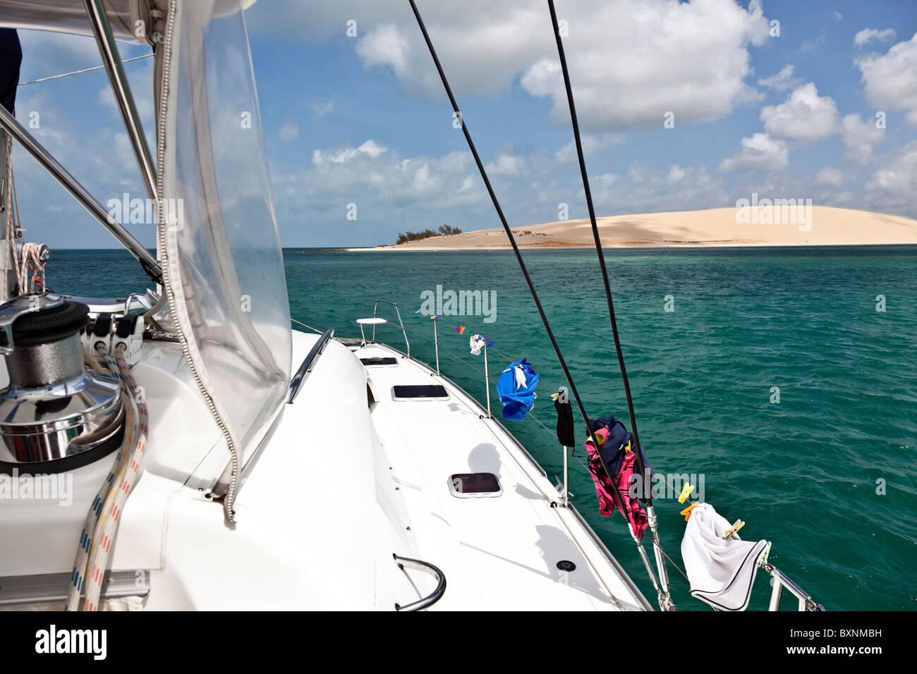 A view over the rail of a luxury catamaran yacht on the approach to an ...