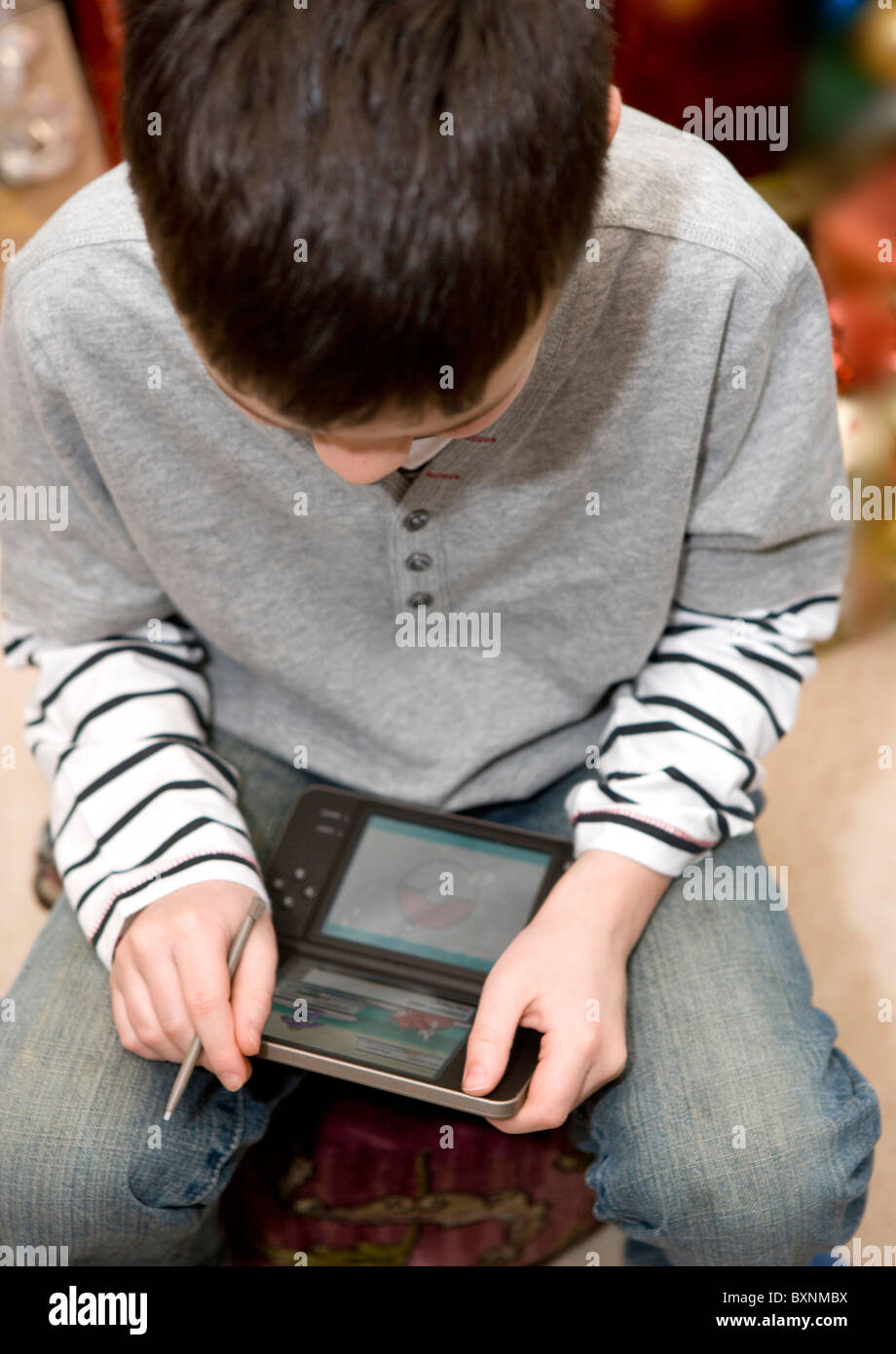 Young Boy Playing with Electronic Computer Games Stock Photo - Alamy