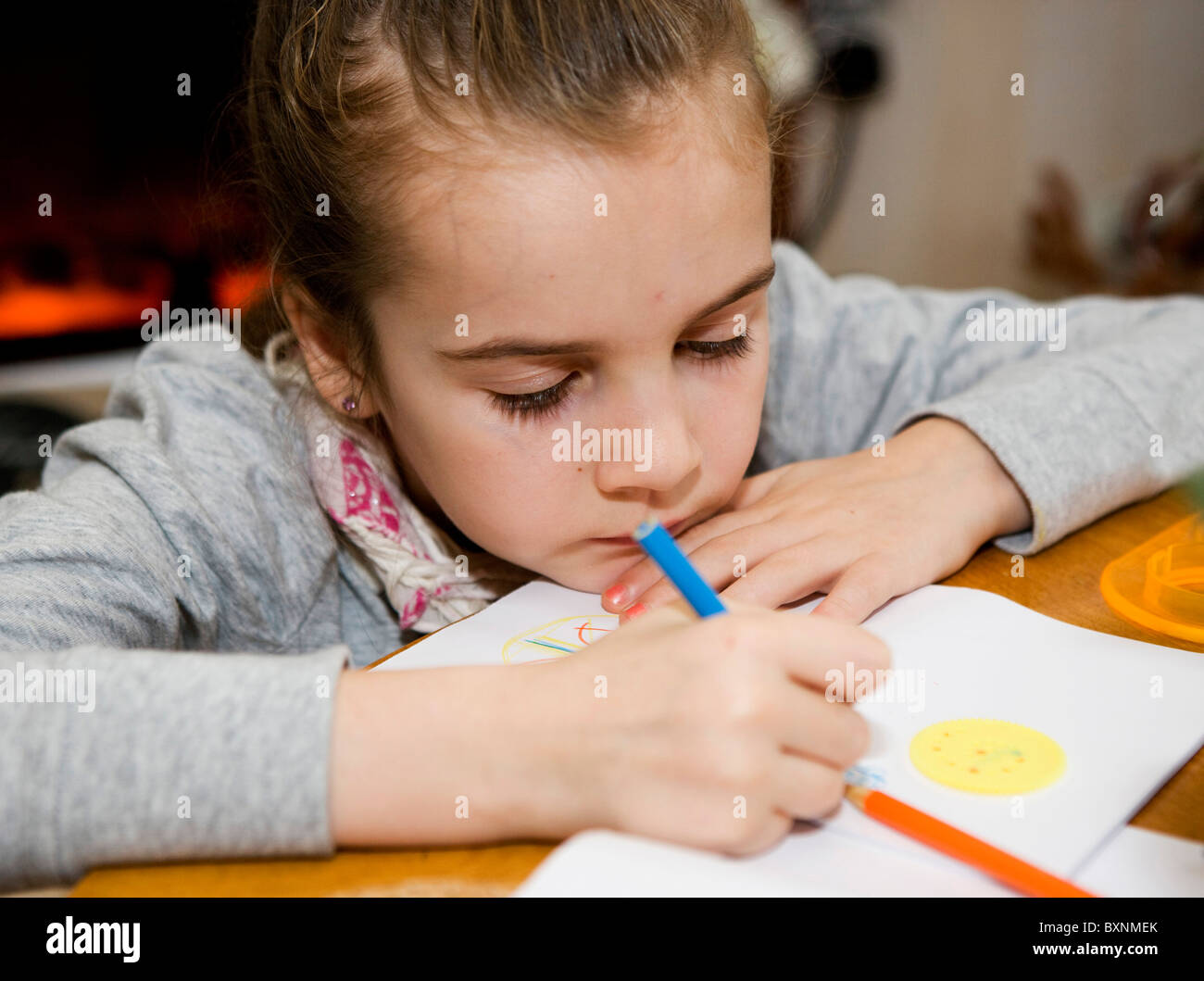 A Child Drawing at Home Stock Photo - Alamy