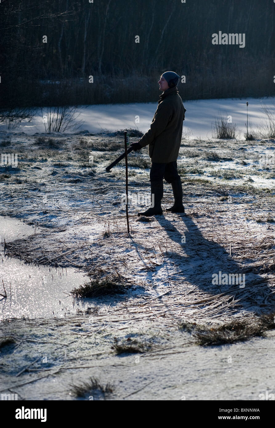 young man standing against winter sunlight Stock Photo - Alamy