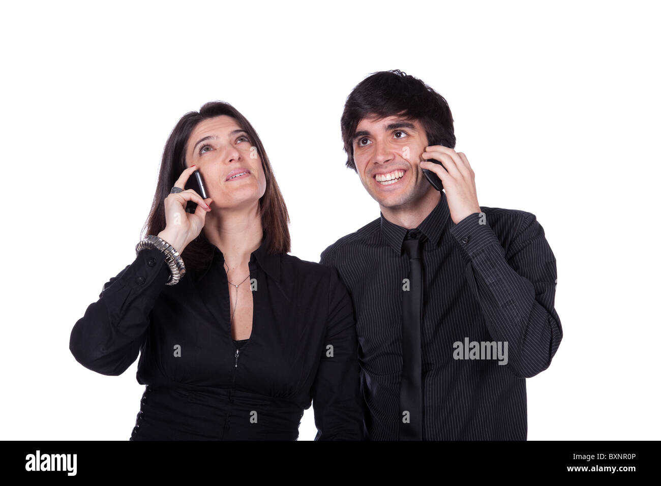 Men and woman side by side talking on the phone Stock Photo - Alamy