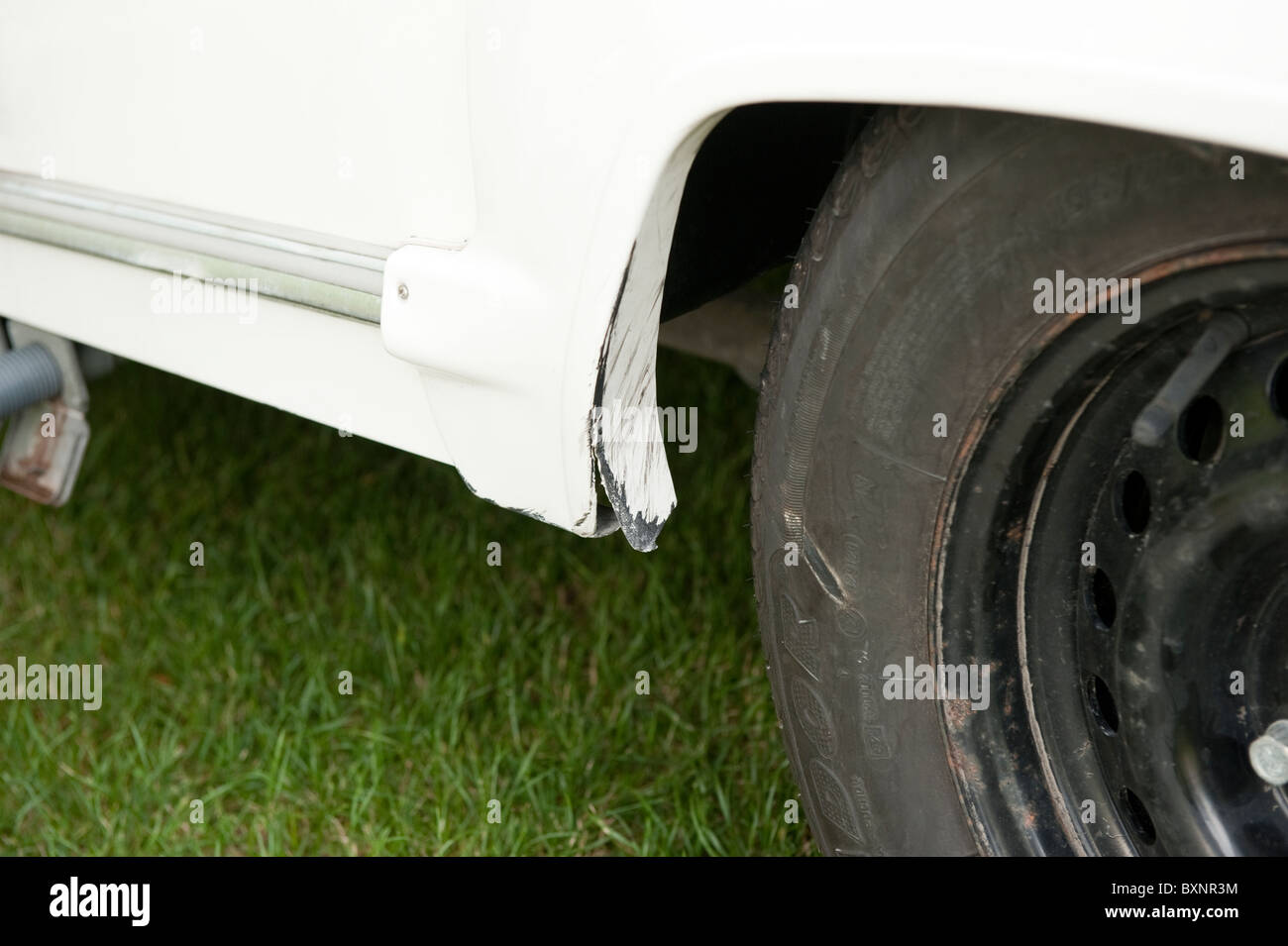 Caravan Wheel and Wheel Arch Damage Stock Photo - Alamy