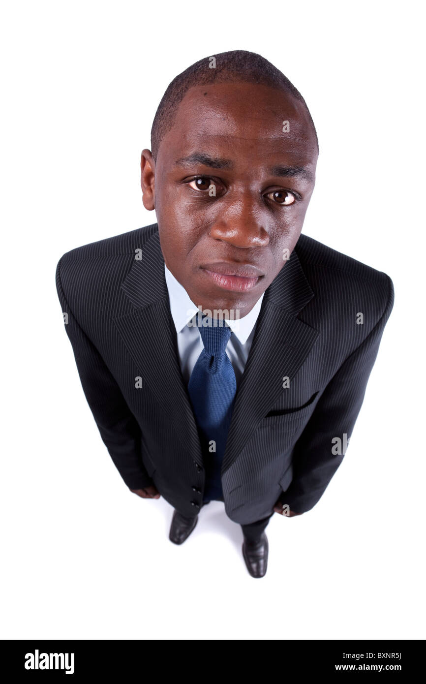 African businessman looking up with a silly expression (isolated on ...