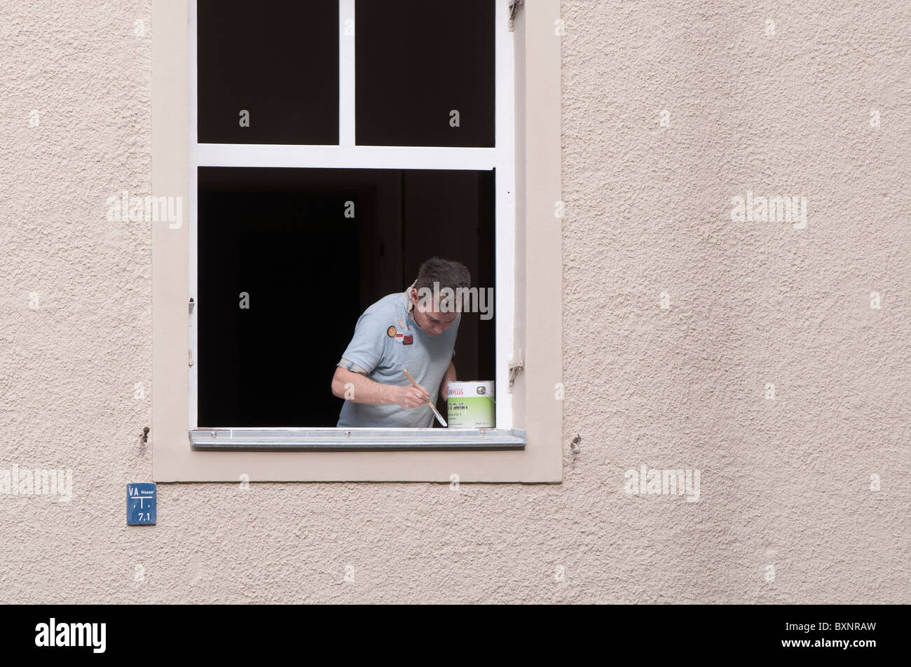 Man painting window hi-res stock photography and images - Alamy
