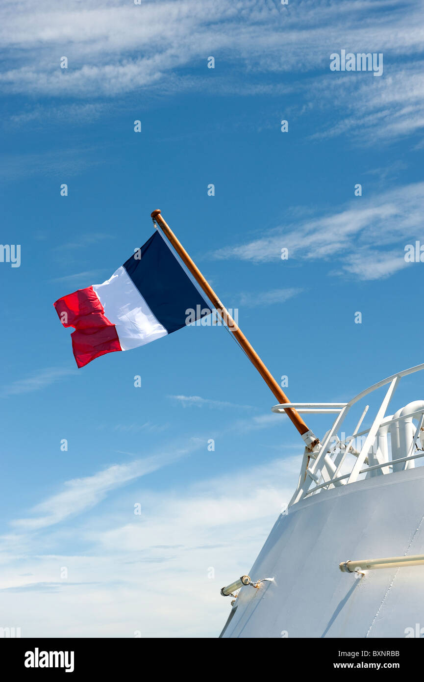 French Flag Flying on Ship against Blue Sky Stock Photo - Alamy