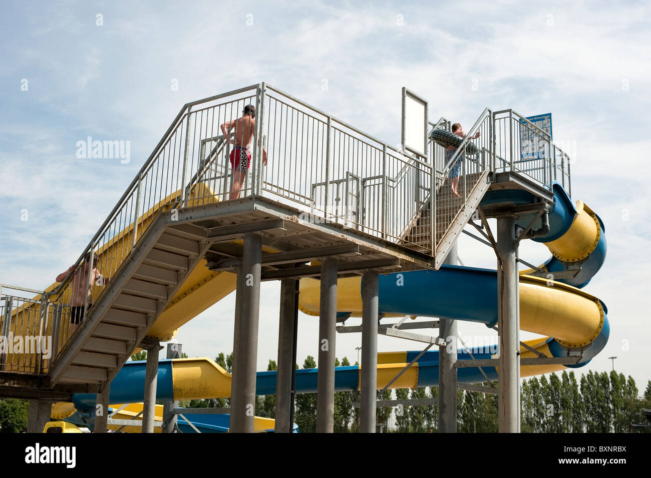 People Climbing Stairs to Outdoor Swimming Pool Slide Stock Photo - Alamy