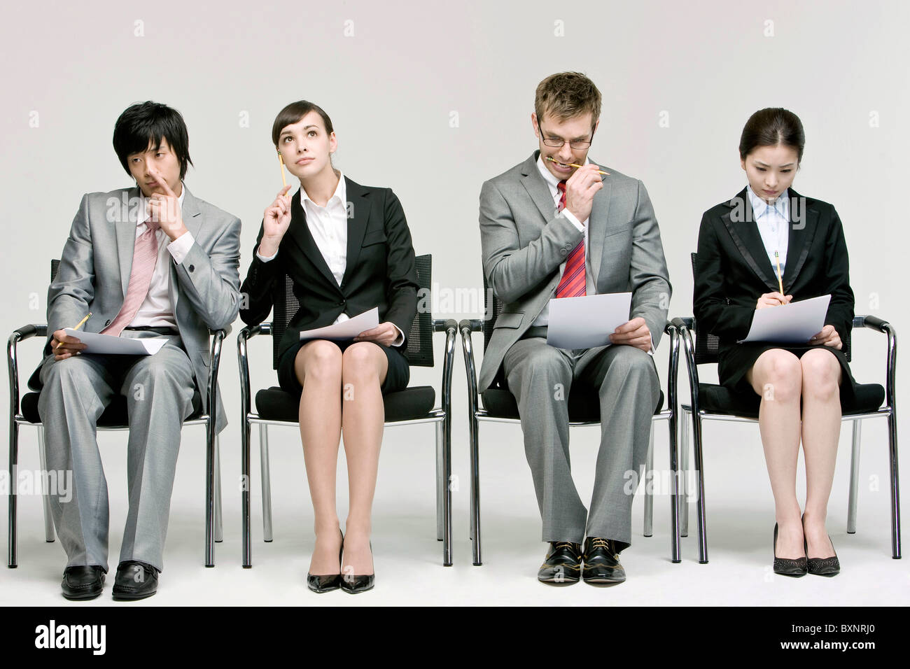 Four people waiting interview sitting hi-res stock photography and ...