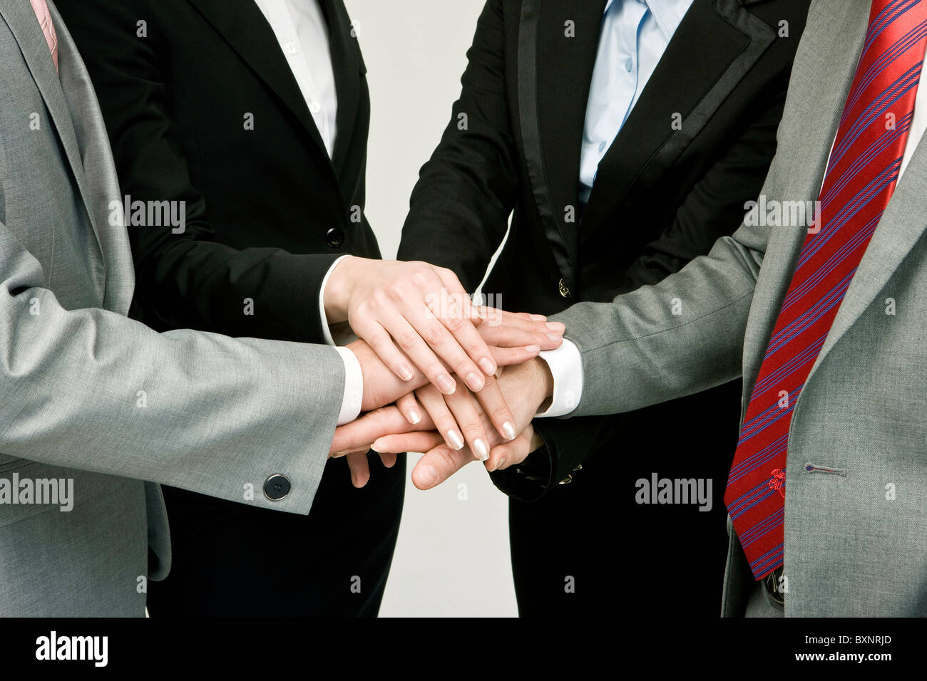 Hands overlapping hi-res stock photography and images - Alamy