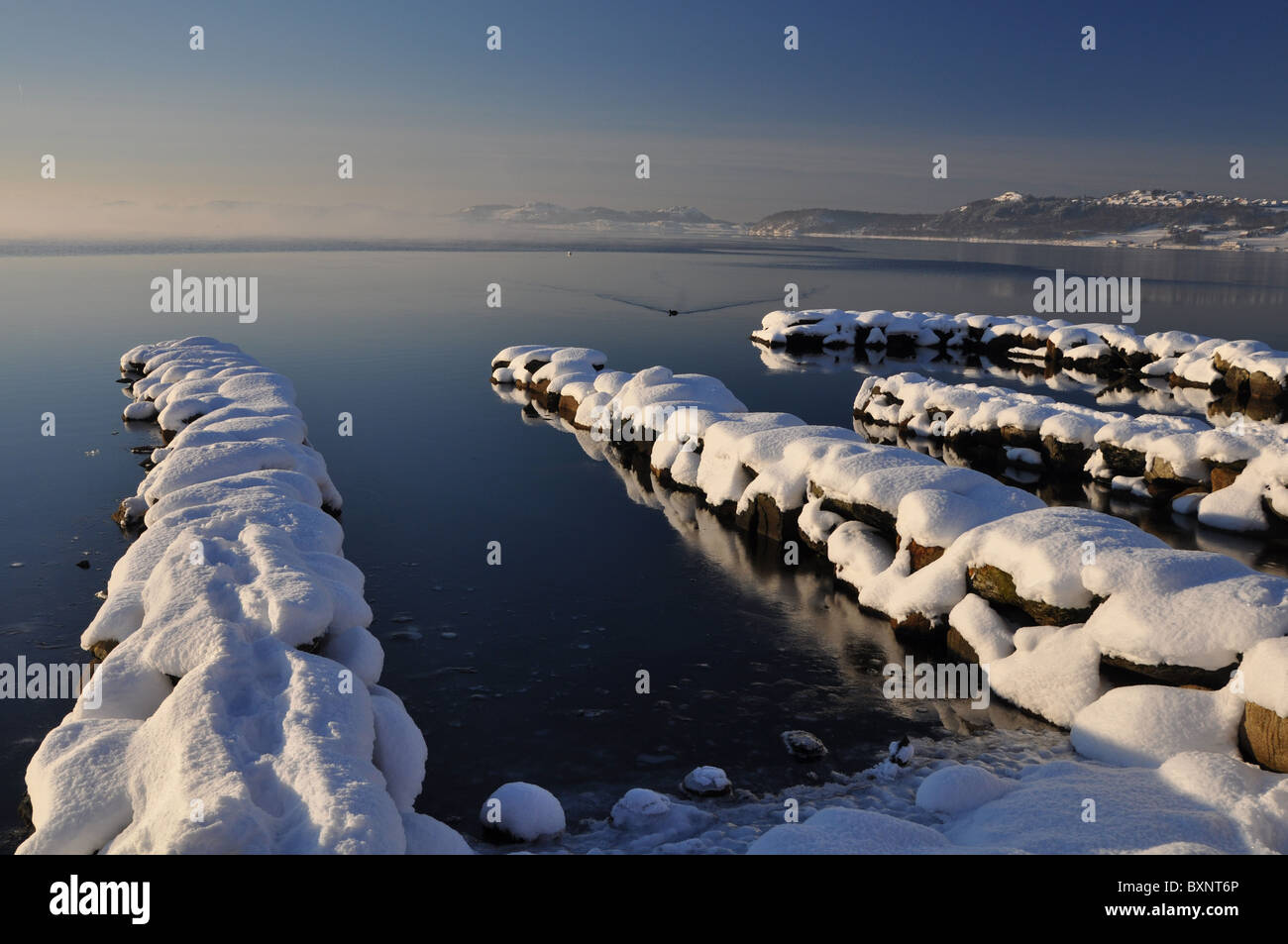 Stone pier, winter, snow, frozen sea, landscape Stock Photo - Alamy