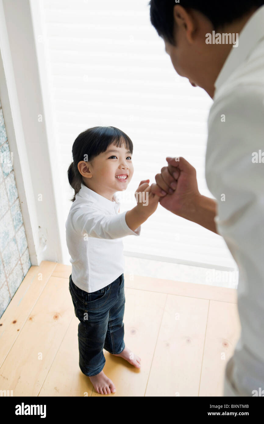 Young girl making a promise with dad Stock Photo - Alamy