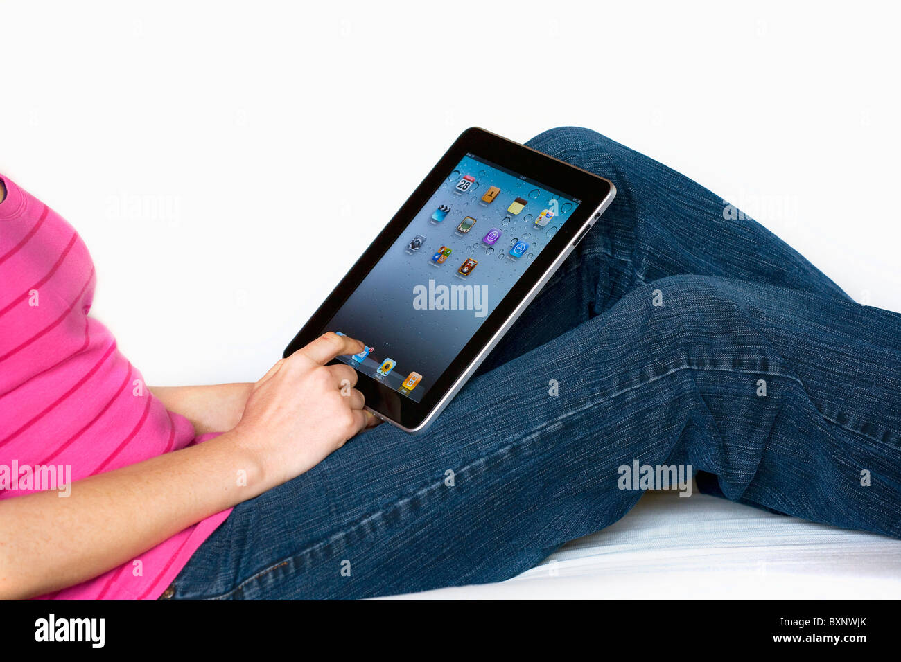 Woman relaxing with ipad on sofa hi-res stock photography and images ...