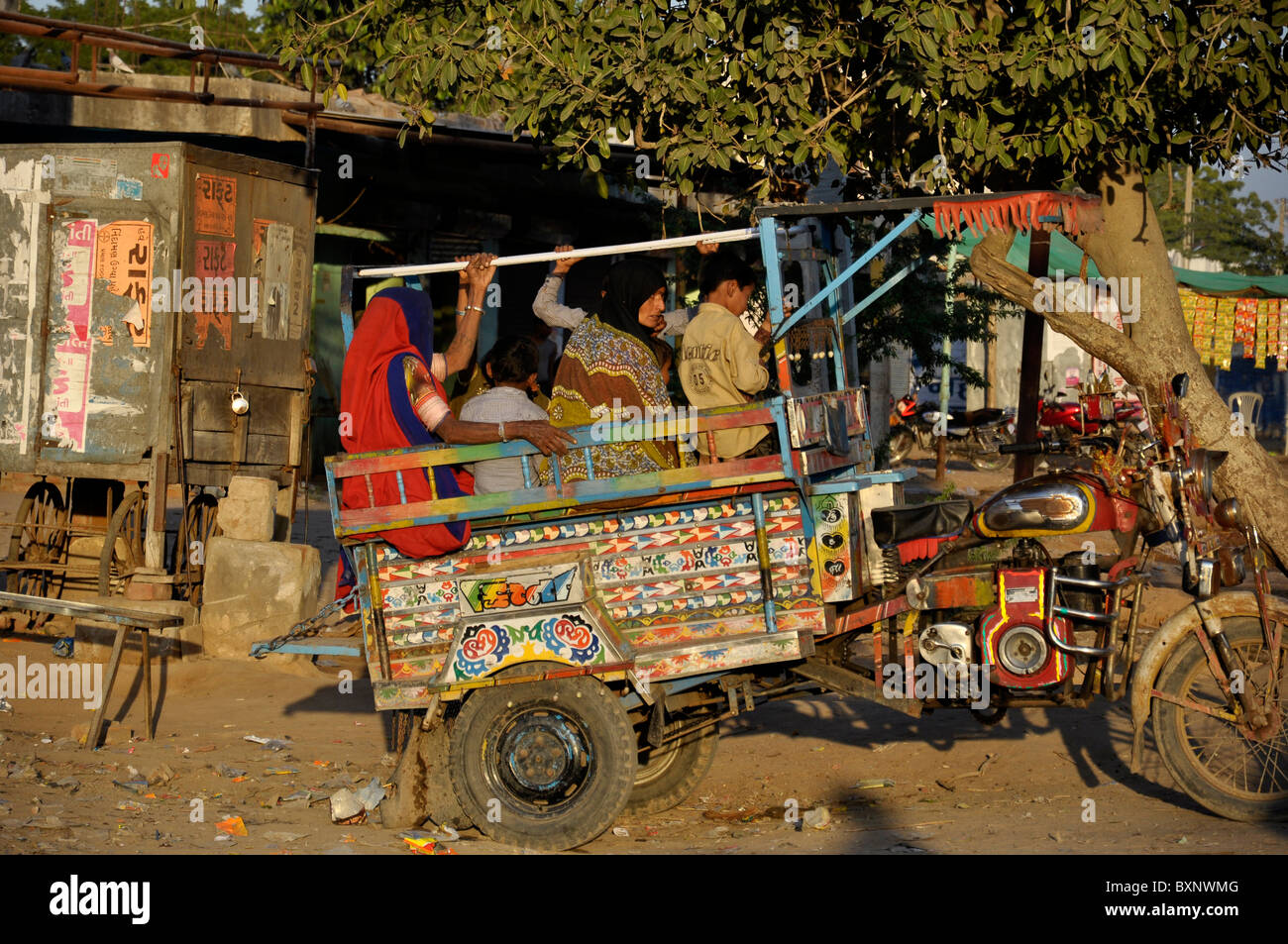 People using an improvised vehicle for transportation in rural Gujarat ...