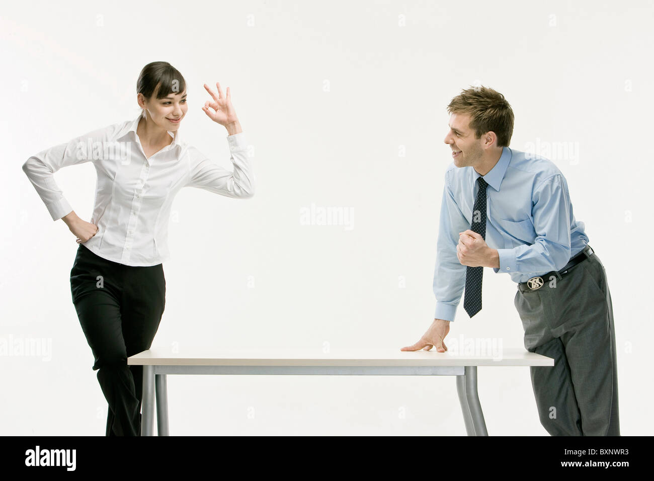 Businessman woman standing across table hi-res stock photography and ...