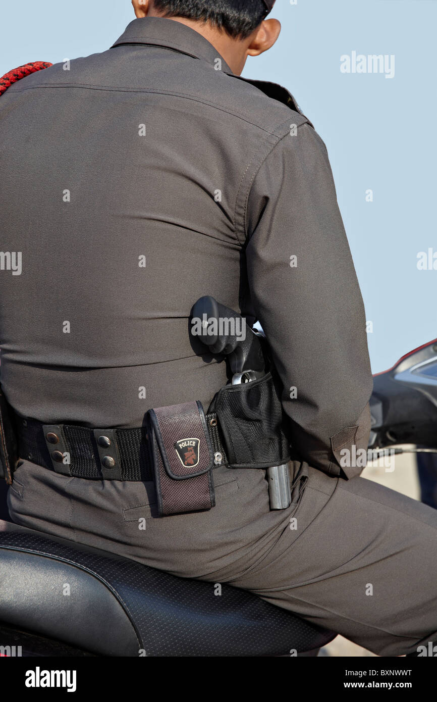 Thai policeman and side arm. Thailand S. E. Asia Stock Photo - Alamy