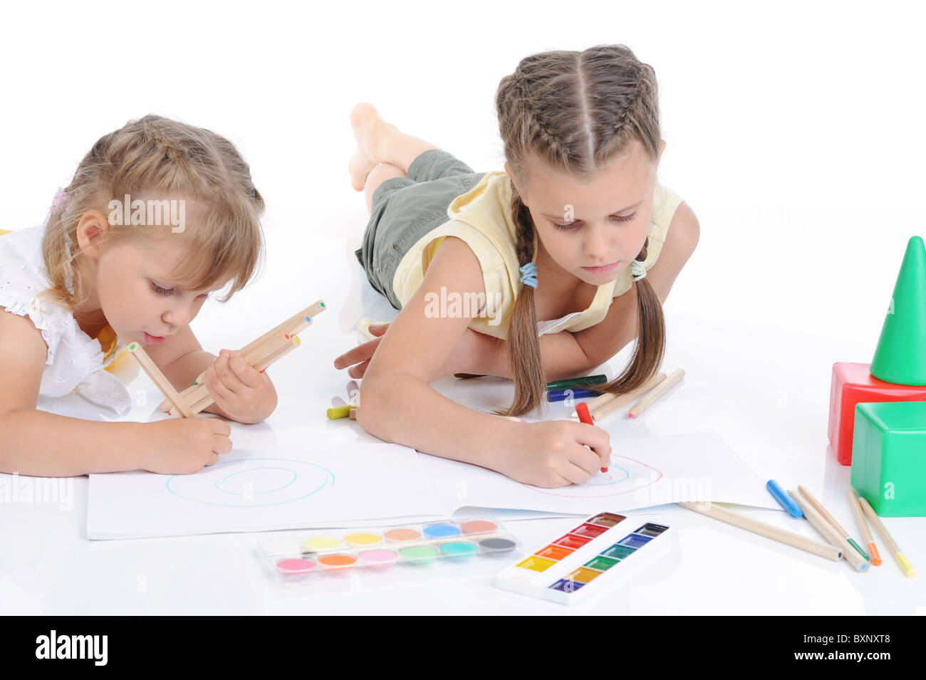 Two cute little girls drawing High Resolution Stock Photography and ...