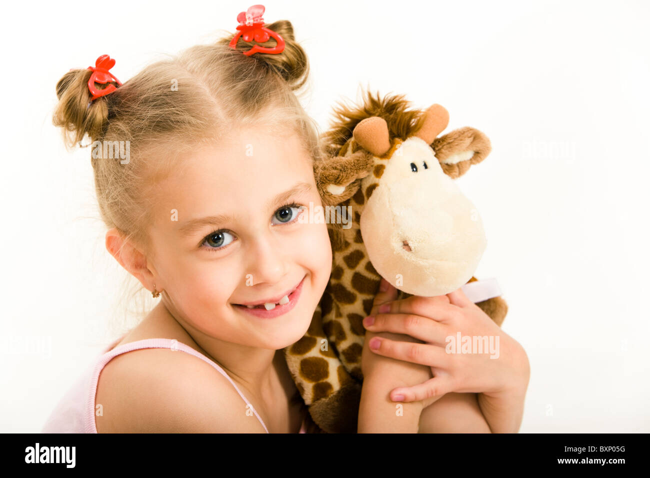 Portrait of beautiful young girl hugging toy giraffe Stock Photo - Alamy