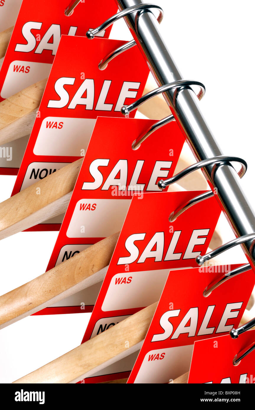 Rail of wooden coathangers with Sale price tags Stock Photo - Alamy