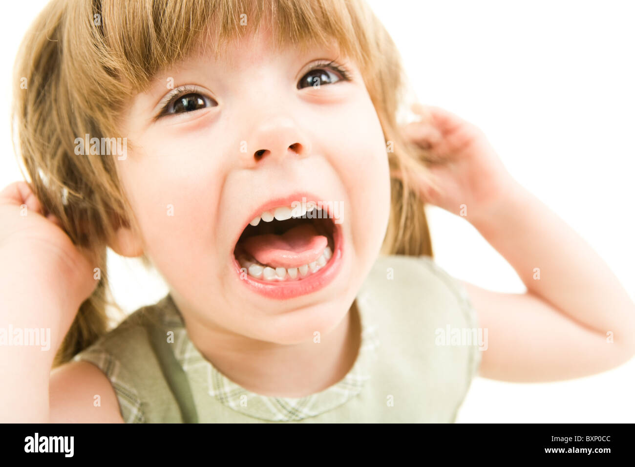 Image of young girl screaming on a white background Stock Photo - Alamy
